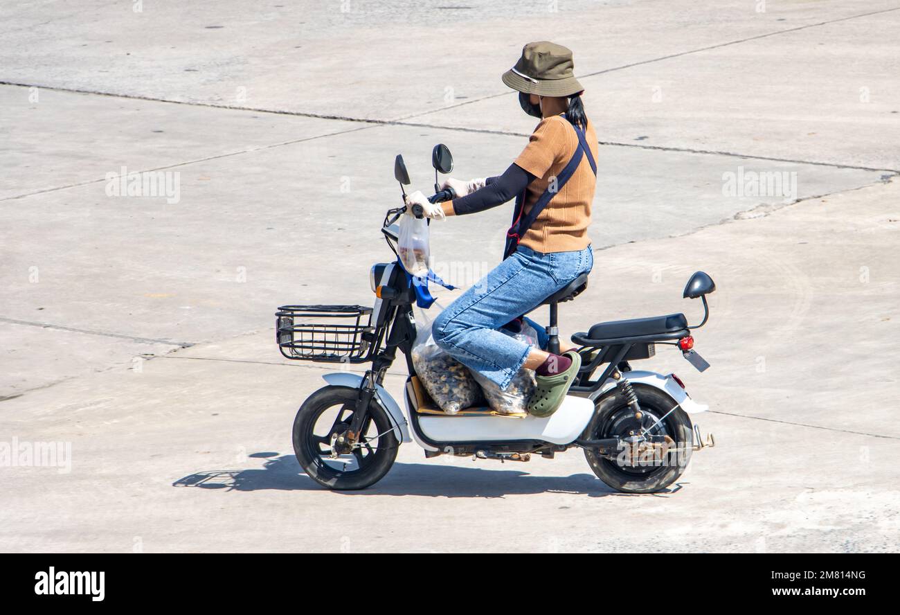Woman electric bike rides hi-res stock photography and images - Alamy