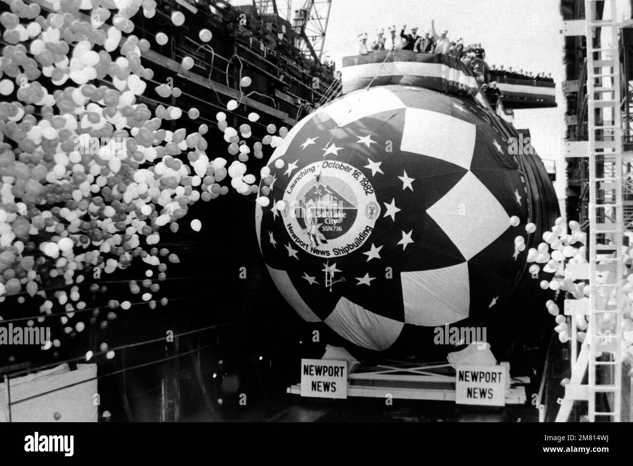 Balloons float skyward as the nuclear-powered attack submarine USS SALT ...