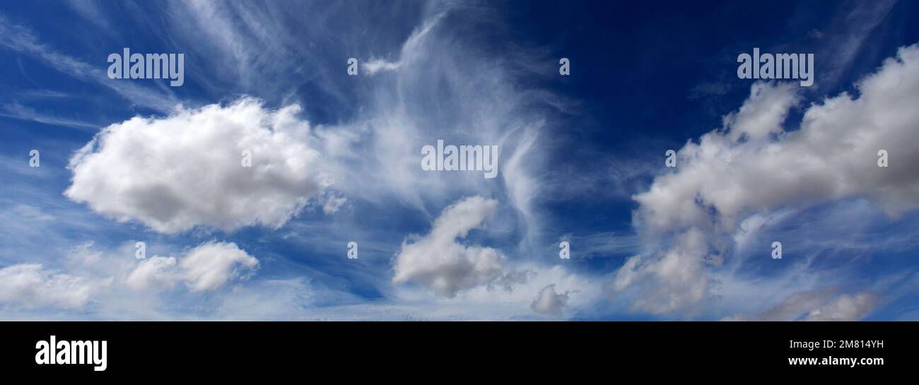 Cumulus humilis clouds in a deep blue sky Stock Photo - Alamy