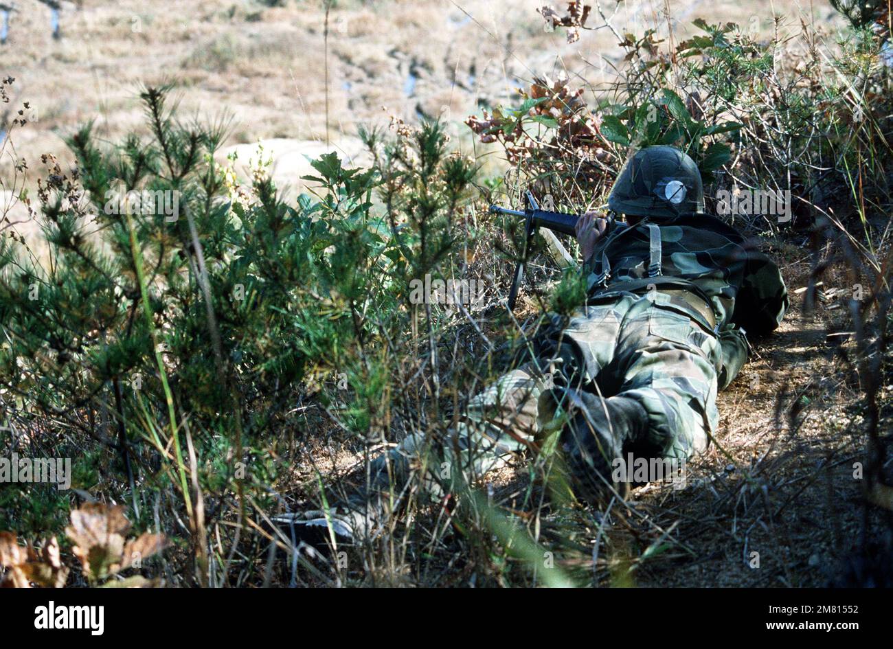 A sniper of the 2nd Division, Republic of Korea Navy Marine Corps, aims ...