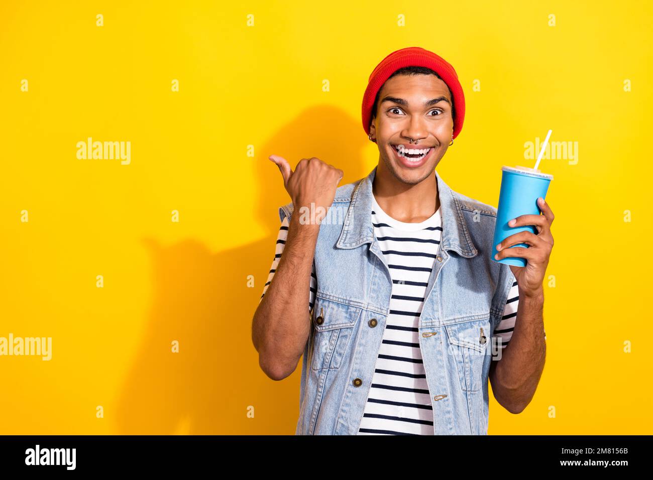 Photo of cheerful stylish man wear trendy clothes arm direct empty ...