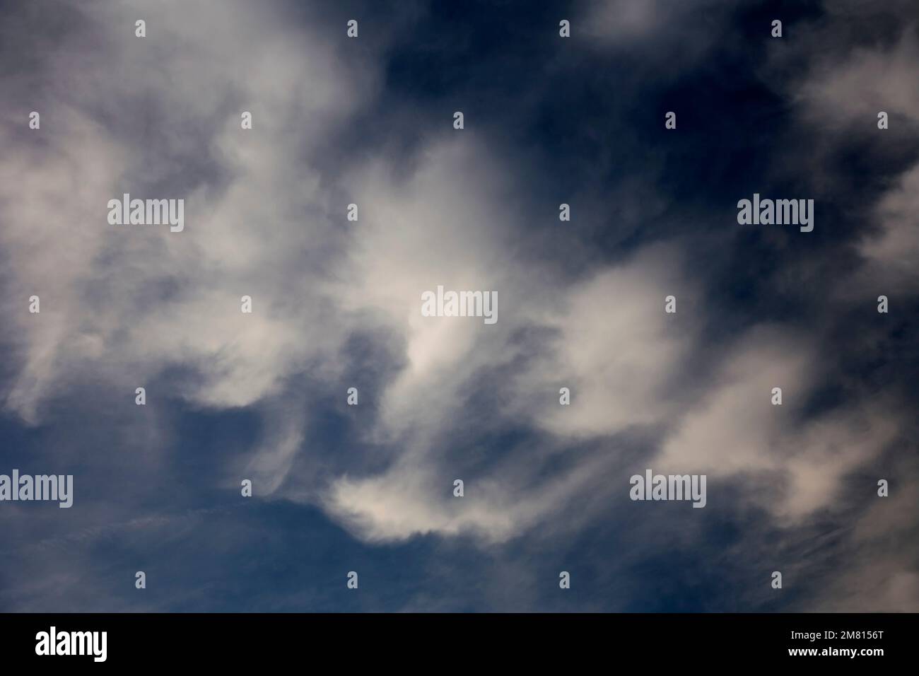 Cirrocumulus floccus clouds in a blue sky Stock Photo - Alamy