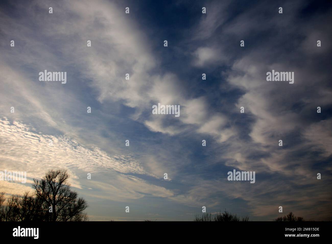 Cirrocumulus floccus clouds in a blue sky Stock Photo - Alamy