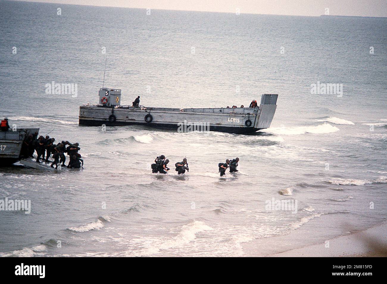 Spanish Marines come ashore from utility landing craft during the joint ...
