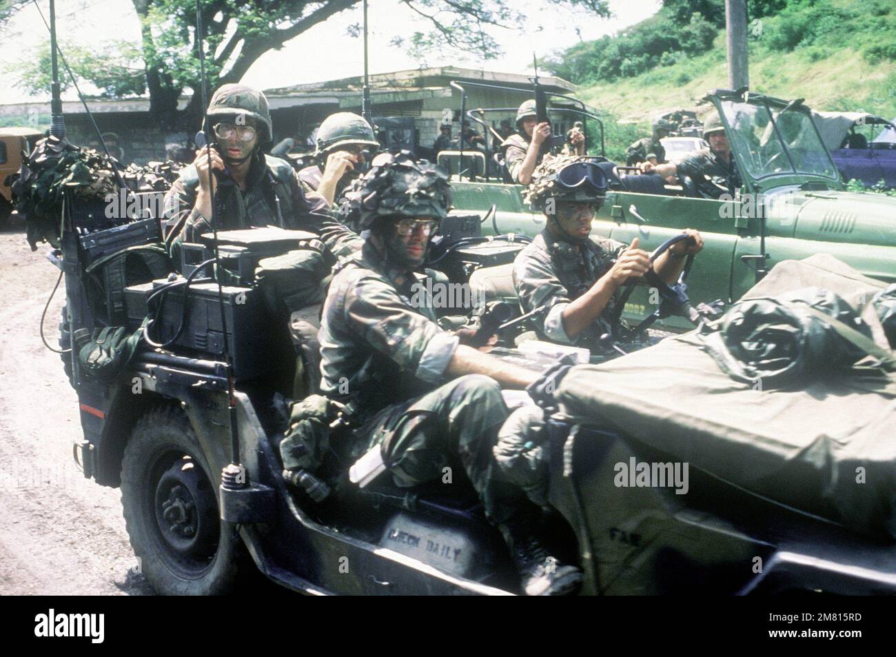 A combined Marine and Army patrol during Operation Urgent Fury. The ...