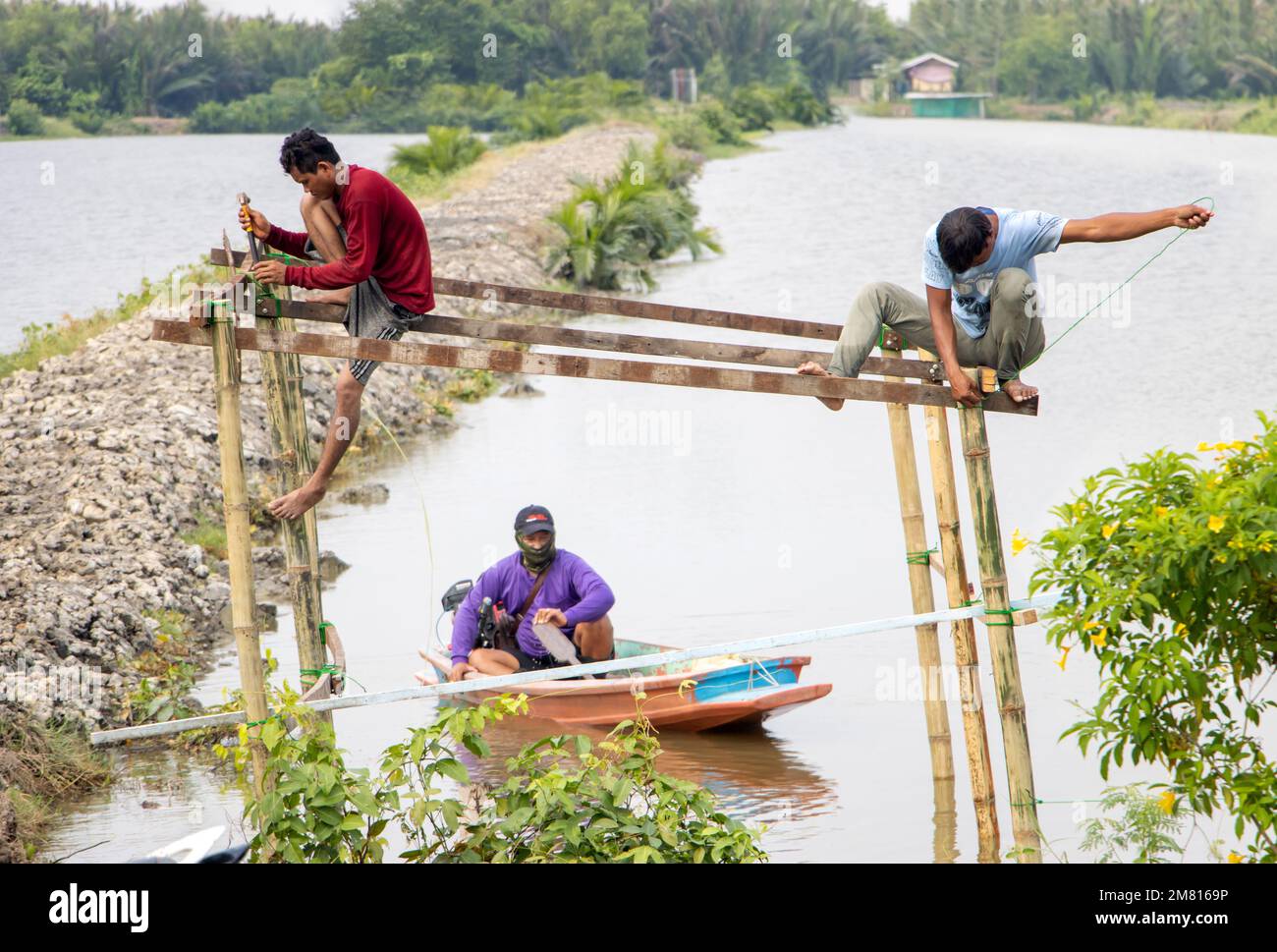 SAMUT PRAKAN, THAILAND, DEC 08 2022, Men work to build a shelter made ...