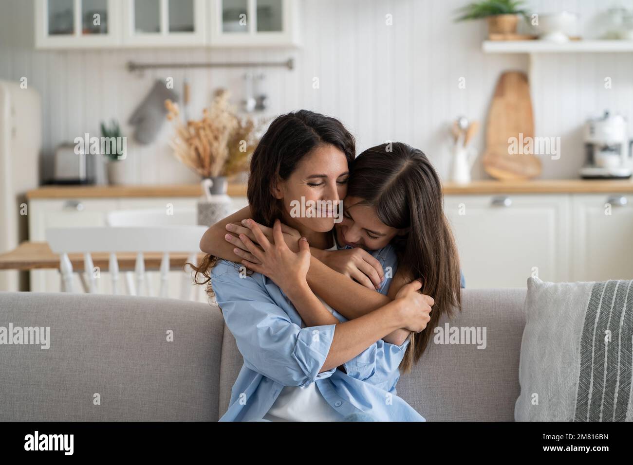 With his daughter clinging behind him hi-res stock photography and ...