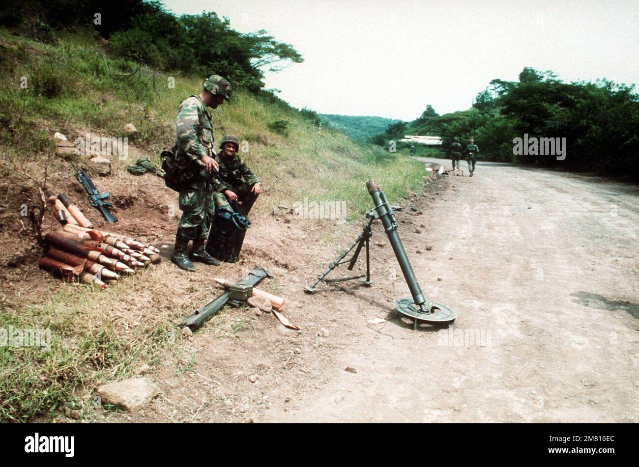 Members of the 82nd Airborne Division take a break while setting up an ...