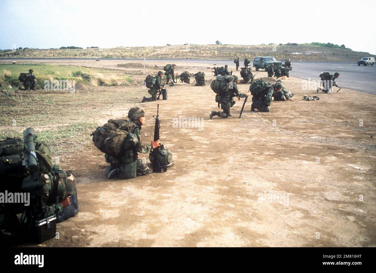 Members of the 82nd Airborne Division assemble their gear and prepare ...