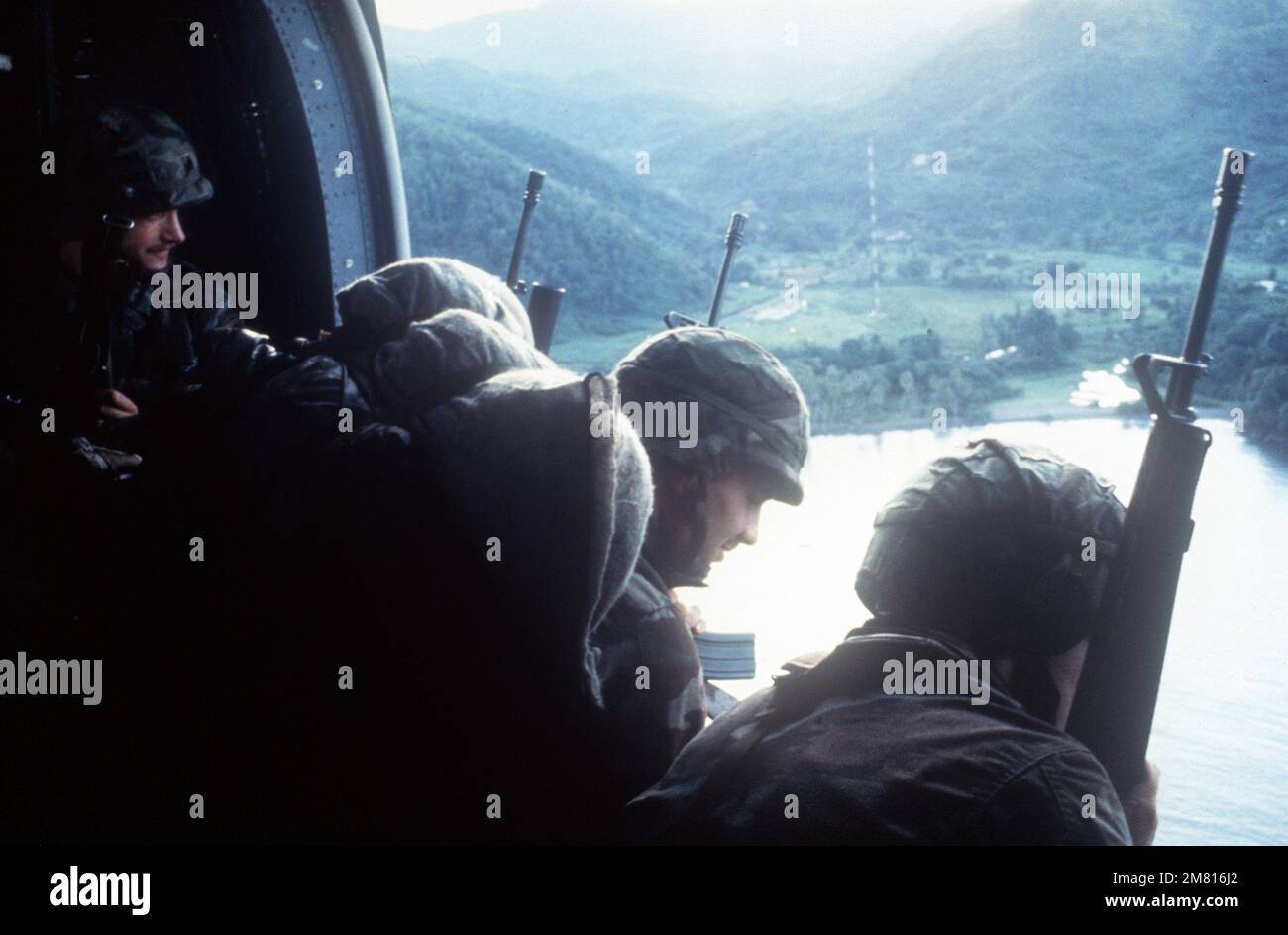 Members of the 82nd Airborne Division are airlifted into a landing zone ...