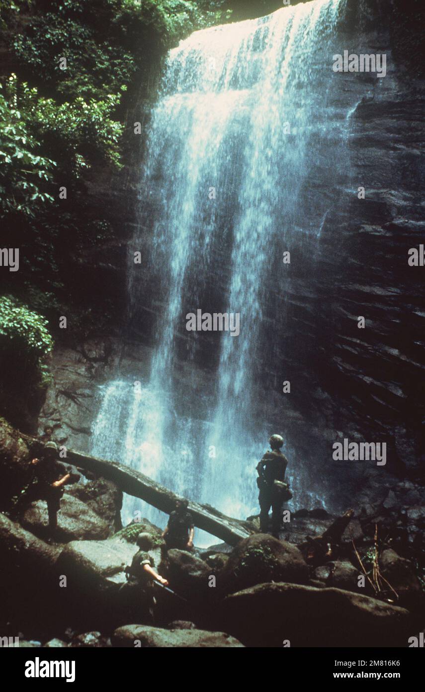 Members of the 82nd Airborne Division patrol search the area near a ...