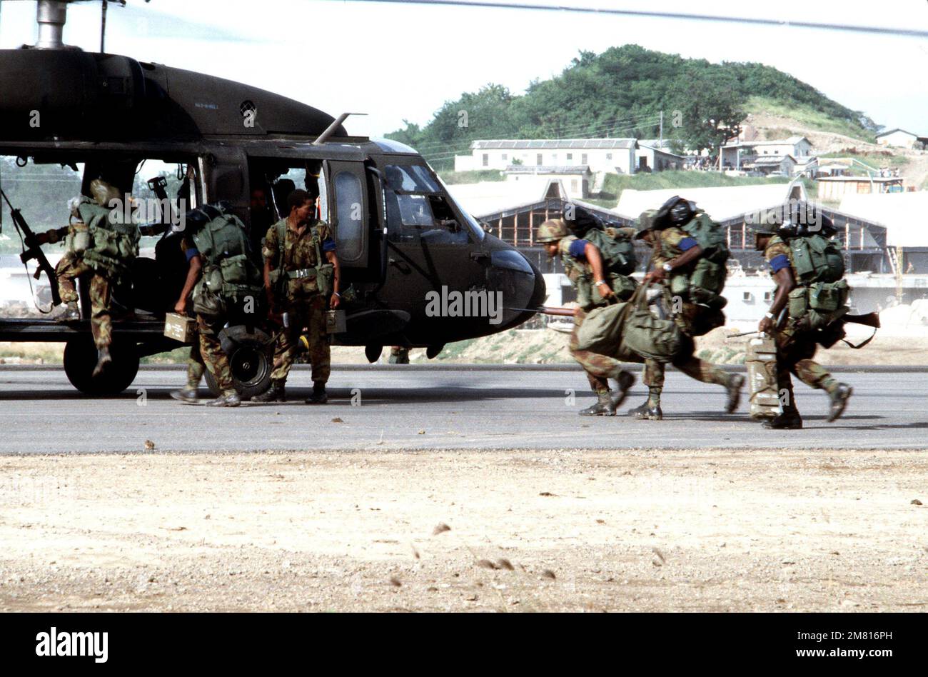 Members of the Eastern Caribbean Defense Force board a UH-60 Black Hawk ...