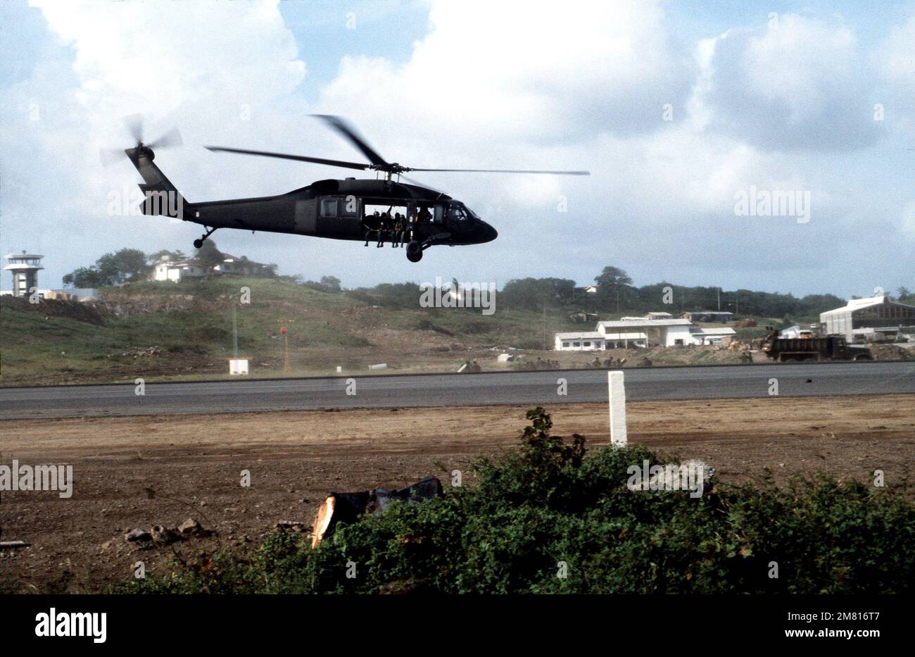 Right side view of a UH-60 Black Hawk helicopter transporting members ...