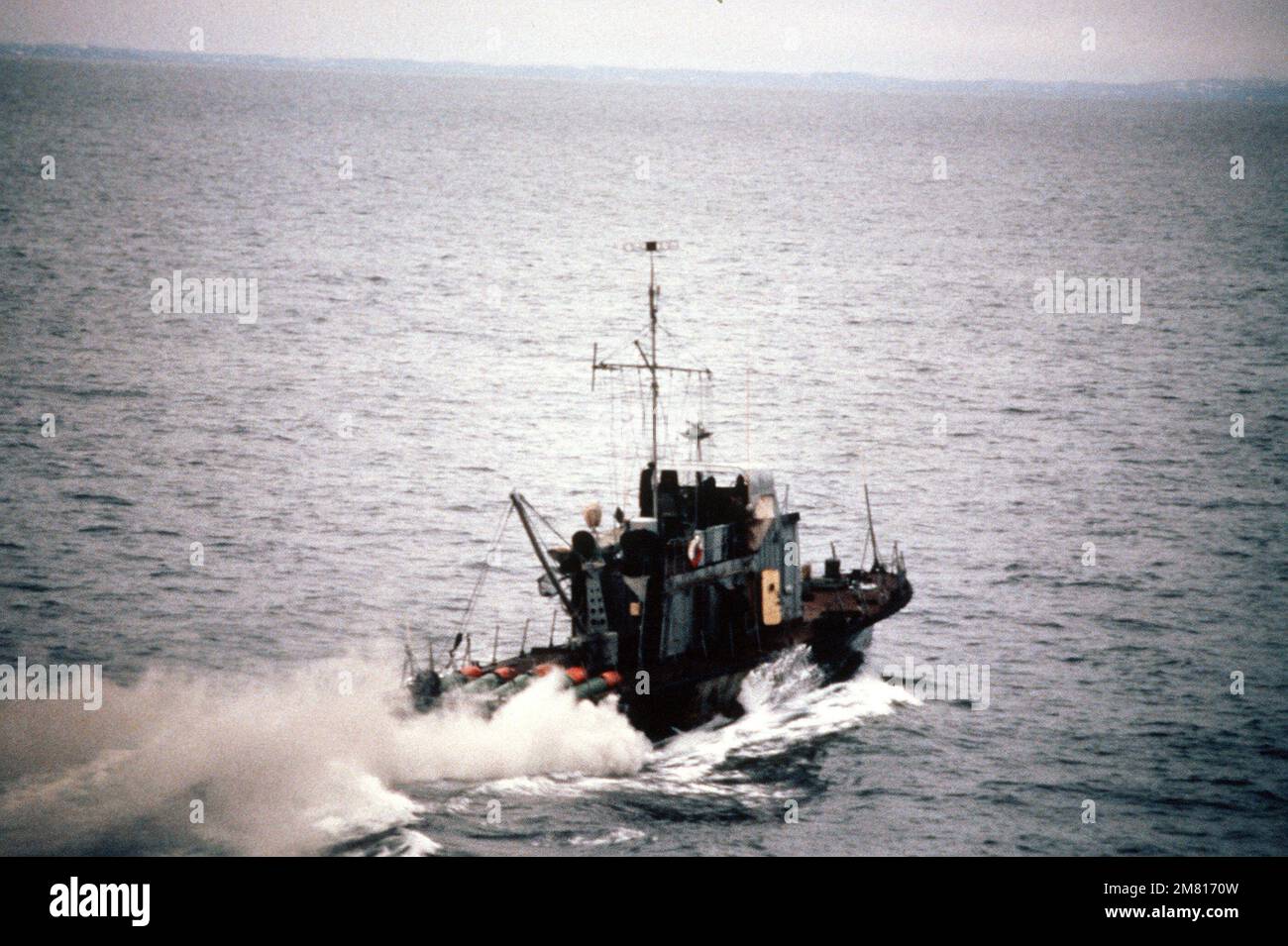 A starboard quarter view of a Soviet torpedo retriever underway ...