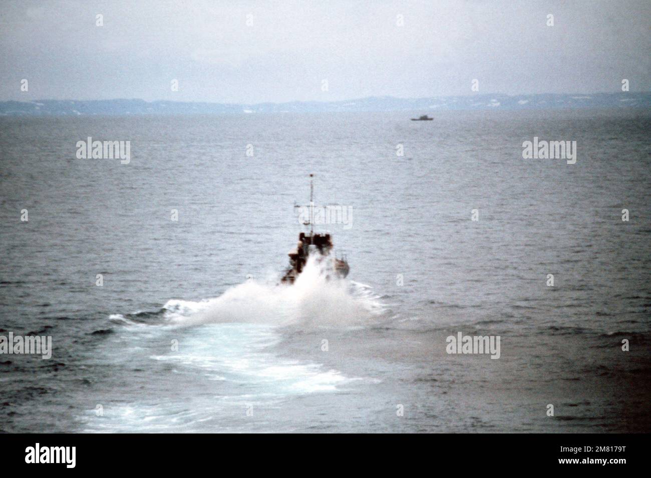 A stern view of a Soviet torpedo retriever underway. (Substandard image ...