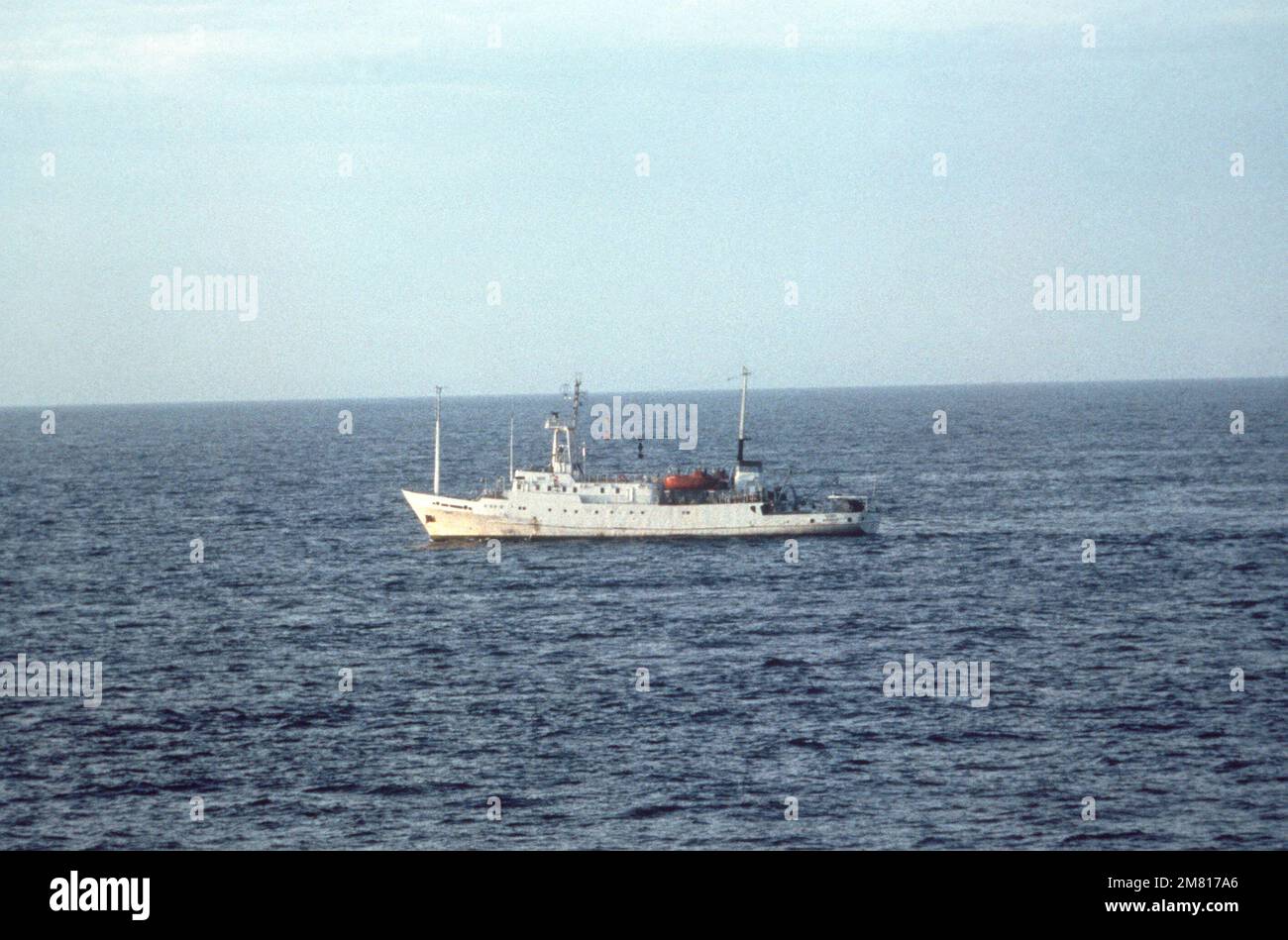 A port beam view of a Soviet intelligence collector ship (AGI) underway ...