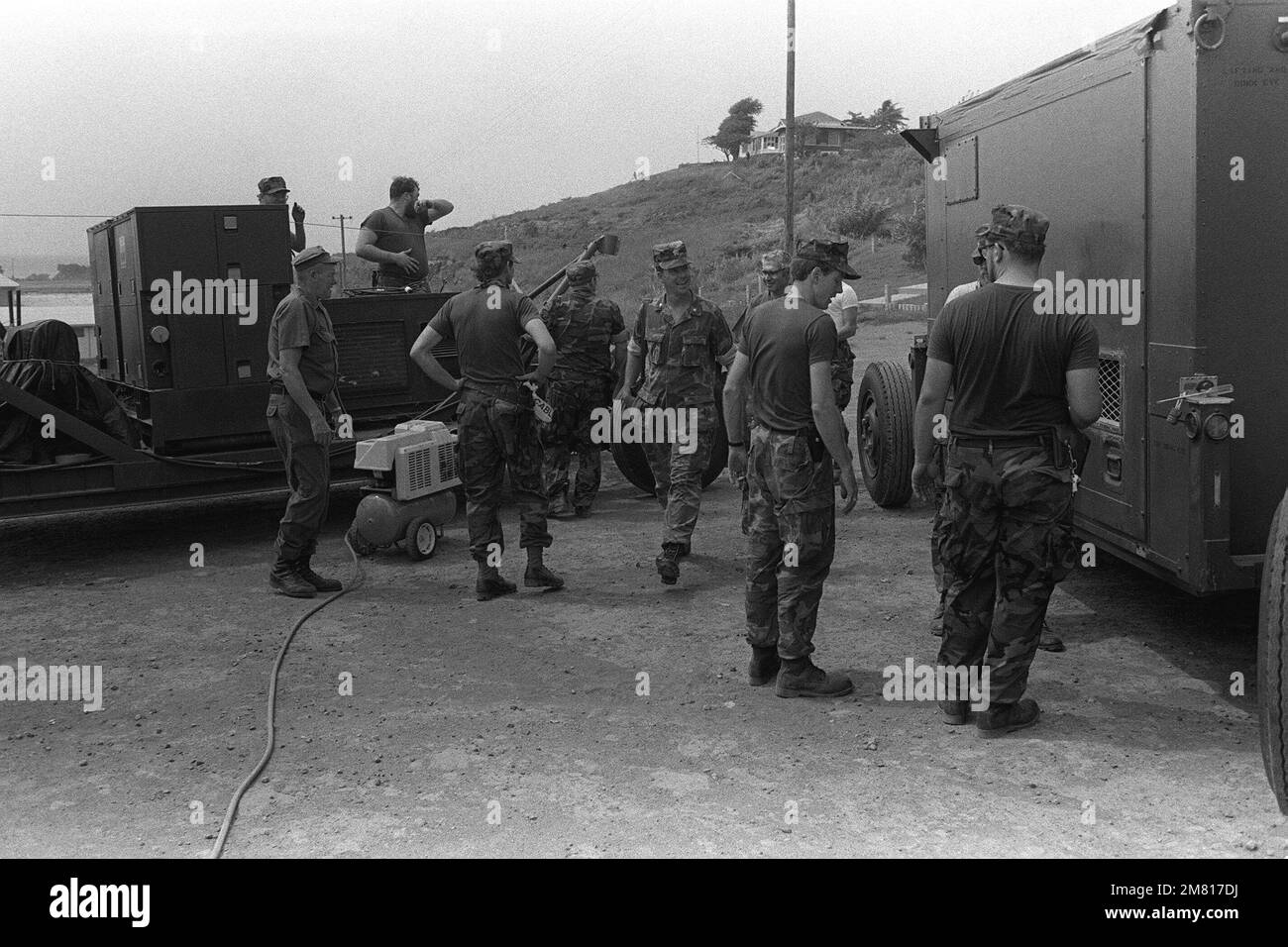 Navy personnel set up communications equipment to establish "Spice ...