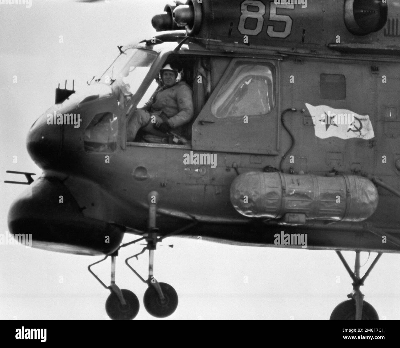 A close-up in the left side view of Ka-25 Hormone helicopter in flight ...