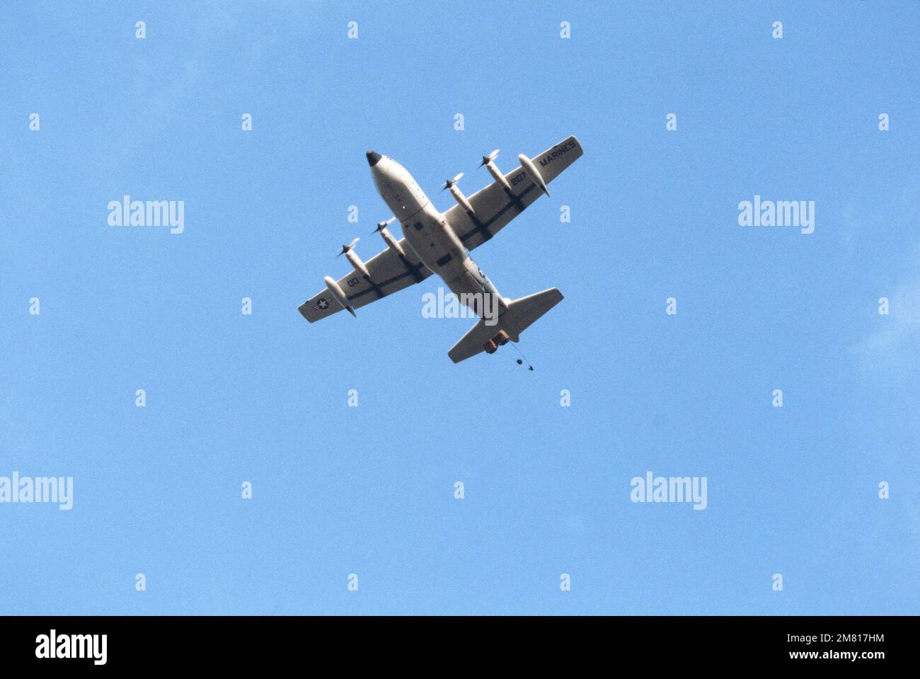 A KC-130 Hercules aircraft drops supplies during Operation BEAR HUNT ...