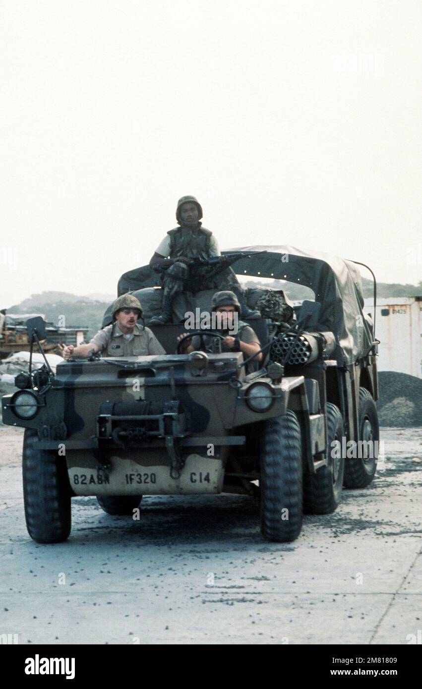 Members of the 82nd Airborne Division ride in an M561 Gamma Goat ...