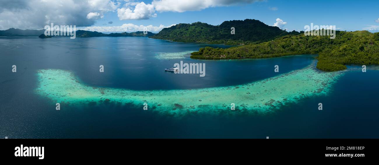 Extensive coral reefs fringe rainforest-covered islands in the Solomon ...