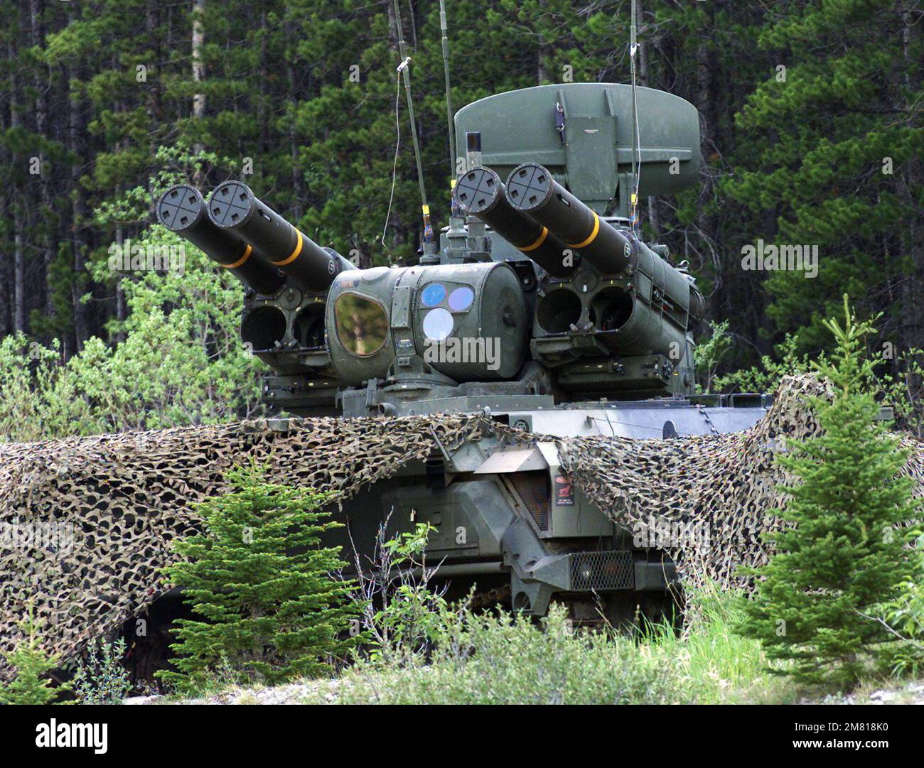 An camouflaged ADATS (Air Defense Anti Tank System) scans the skies ...