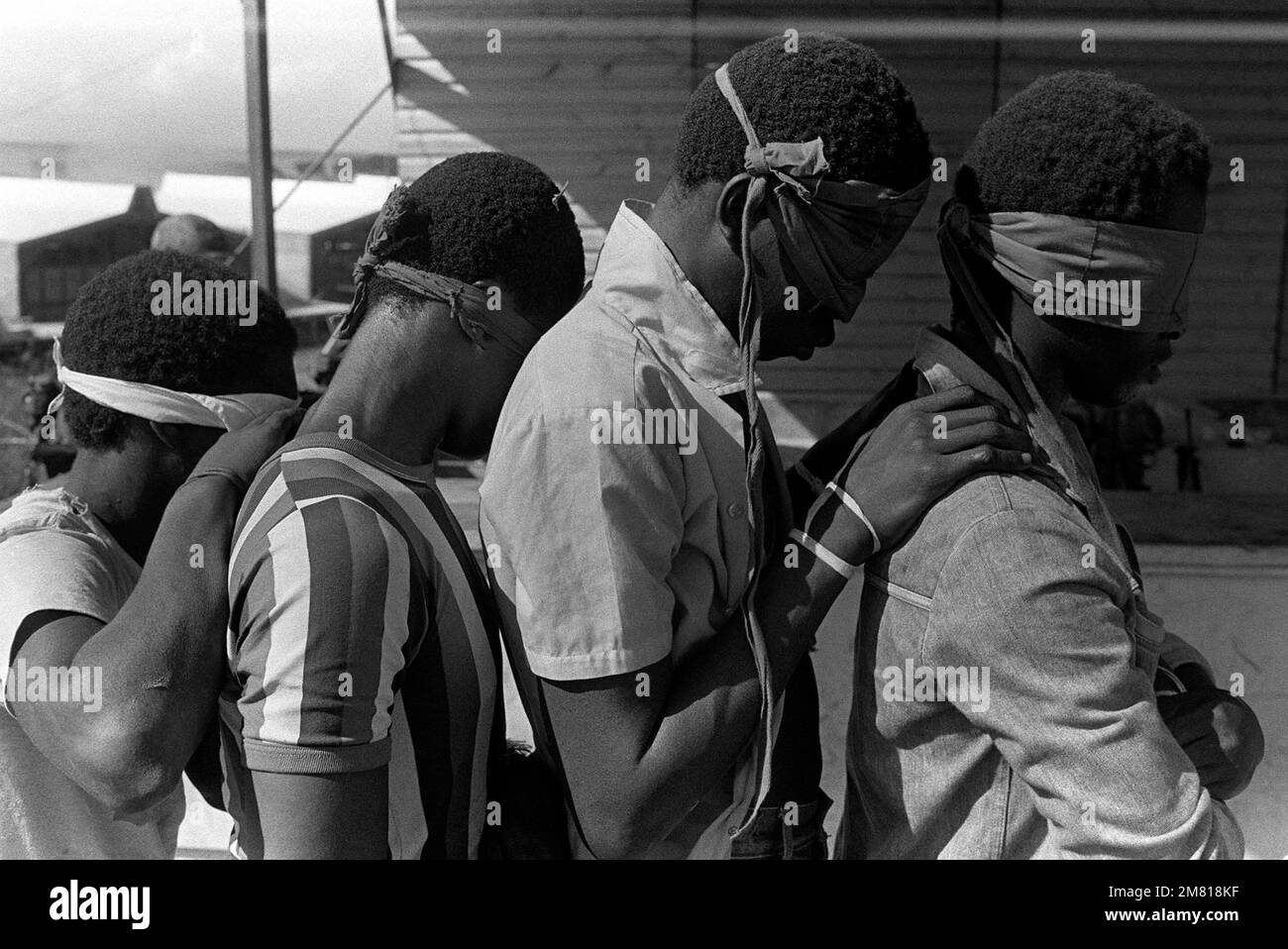 Members of the People's Revolutionary Army are blindfolded after their ...
