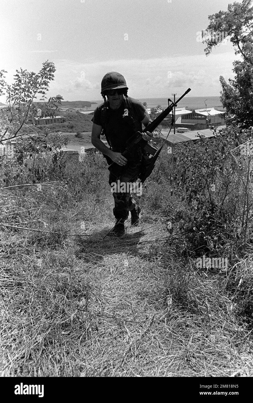 A member of the US Air Force security team, armed with an M16A1 rifle ...