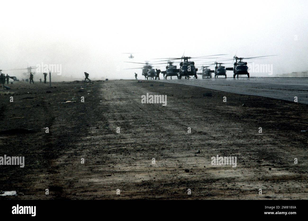 A formation of UH-60 Black Hawk helicopters land at Point Salines ...