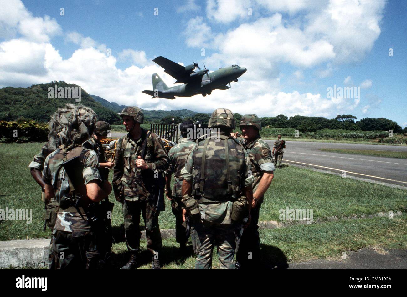 Members of the 82nd Airborne Division prepare to depart for a patrol during Operation URGENT ...