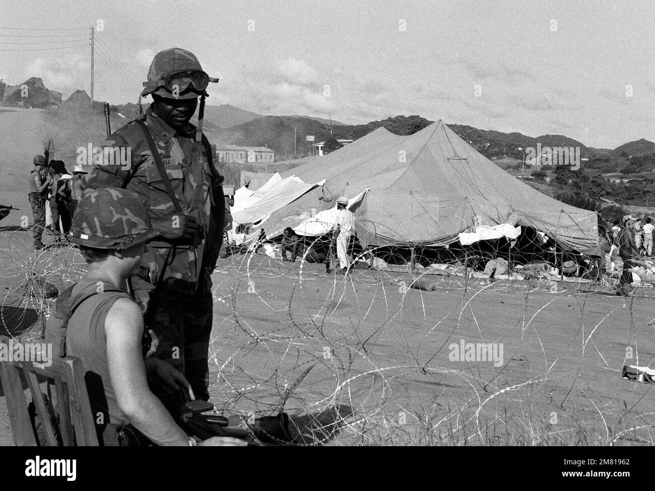 US servicemen stand guard at a detention compound for Cuban nationals ...