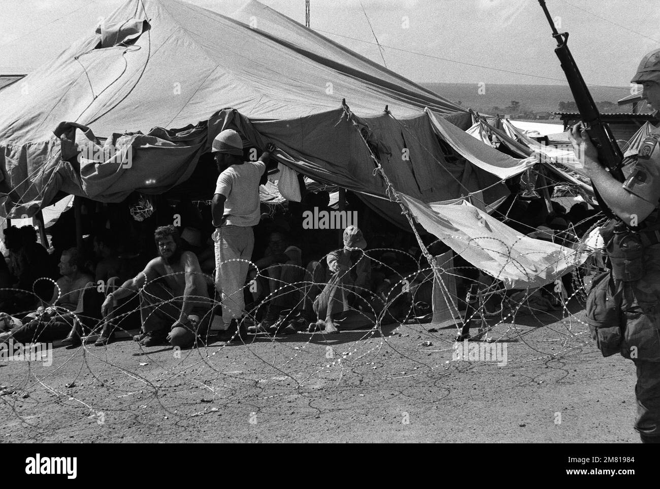 A member of the 82nd Airborne Division stands guard at a detention ...