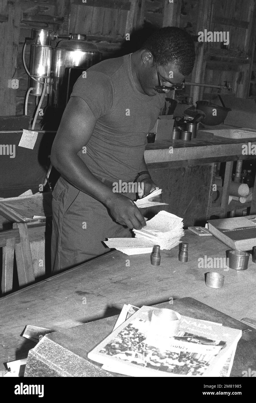 An airman helps process-in US Air Force personnel at the US Joint ...