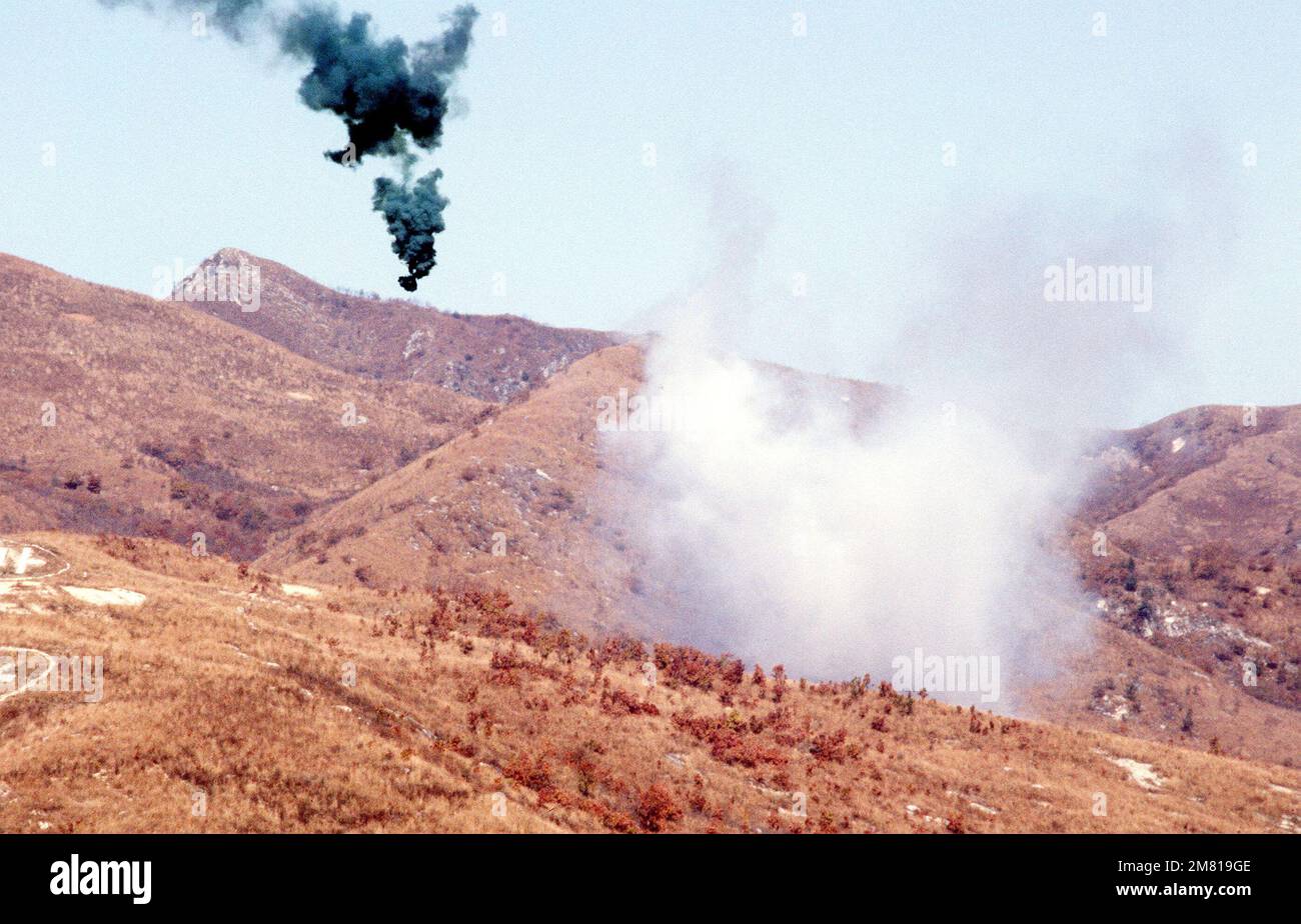 A green smoke flare is used as "open-fire" signal at Nightmare Range ...