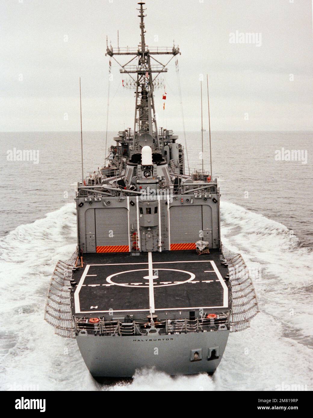 An aerial stern view of the guided missile frigate HALYBURTON (FFG 40 ...