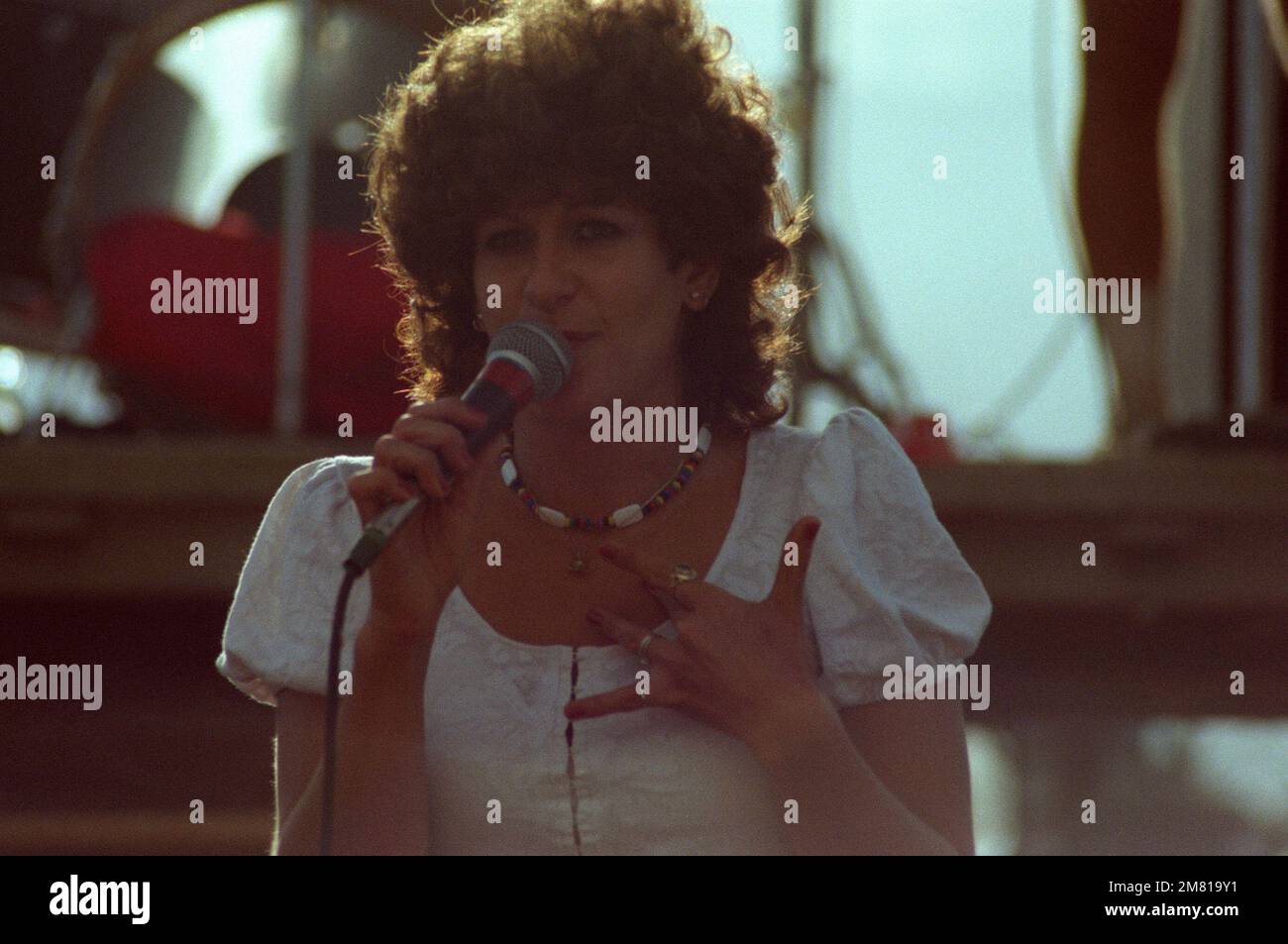 Liz Marks, lead singer in the band Nickelodeon, performs in a USO ...