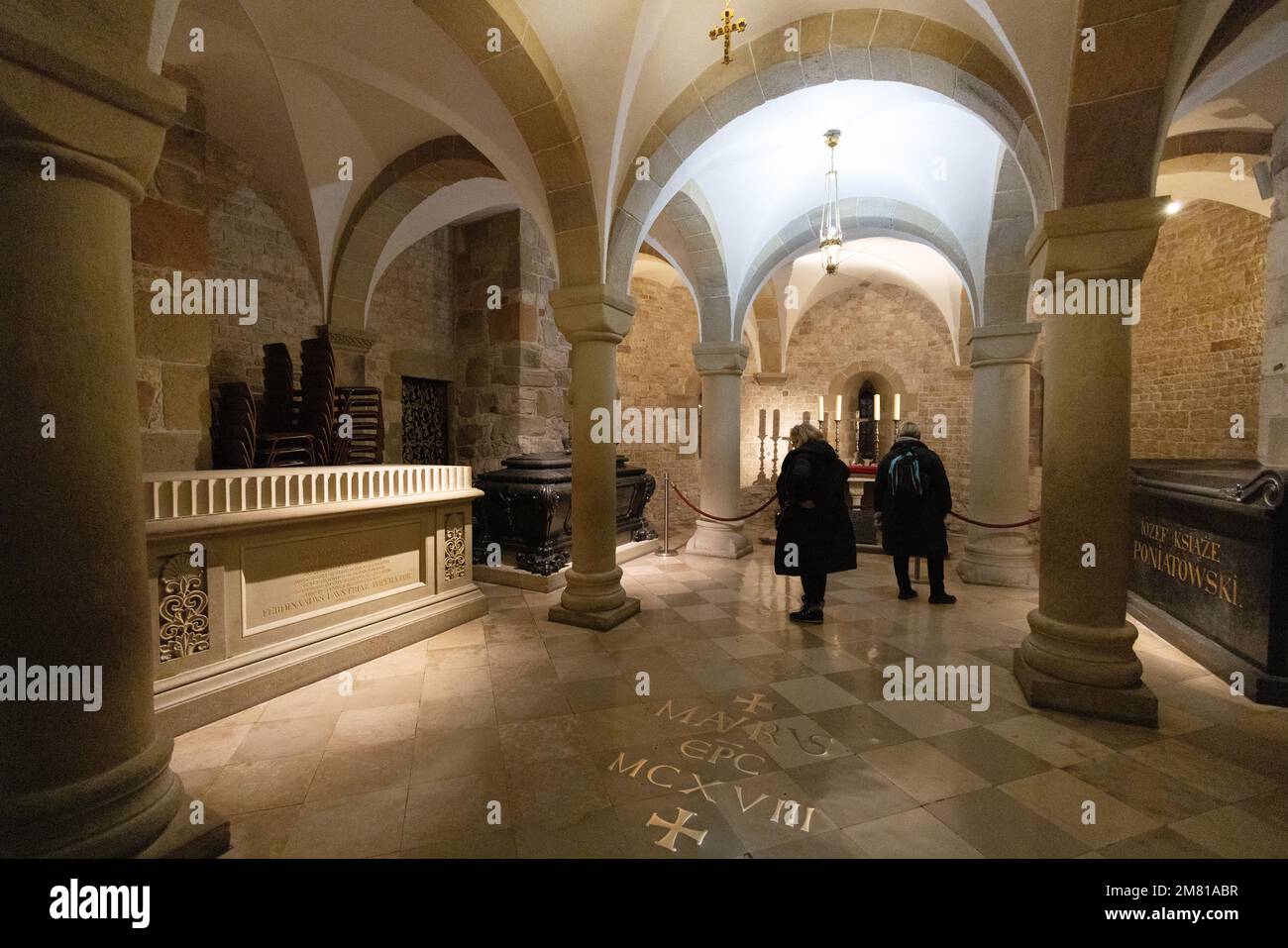 Wawel cathedral Krakow; Visitors in the crypt of the cathedral, Krakow ...