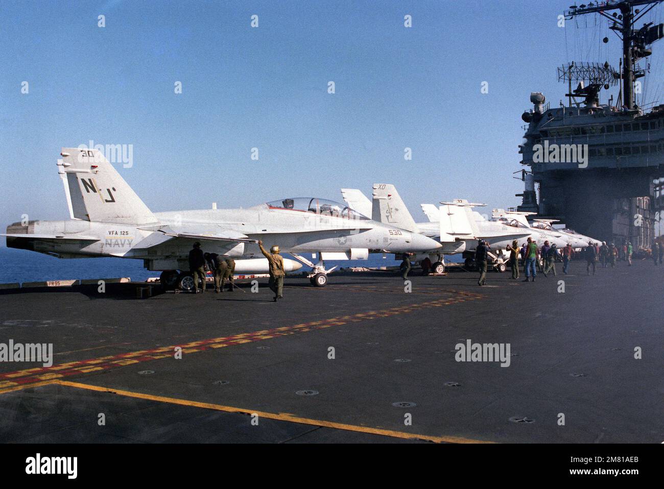 A right side view of F/A-18 Hornet aircraft from Strike Fighter Squadron 125 (VFA-125) parked on ...