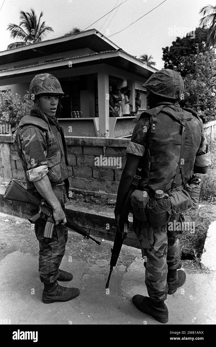 Two Marines armed with an M16A1 rifles, after their arrival with the Battalion Landing Team A ...