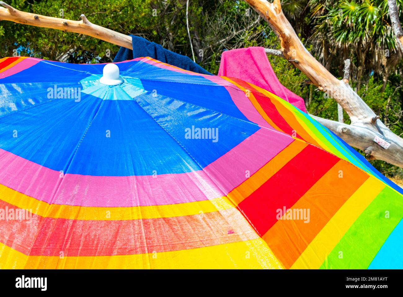 Colorful parasol with many colors on the beach in Playa del Carmen ...