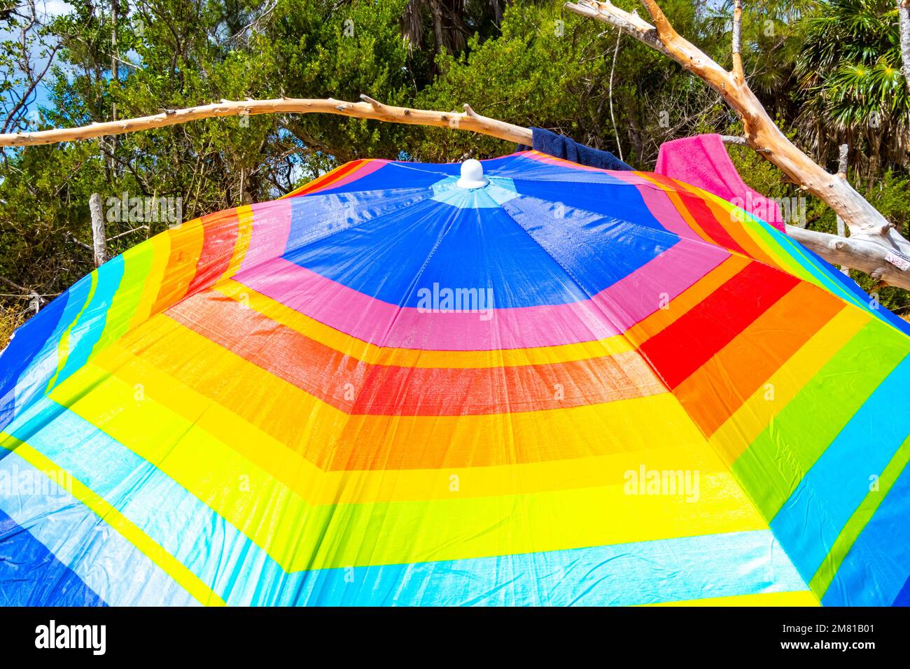 Colorful parasol with many colors on the beach in Playa del Carmen ...