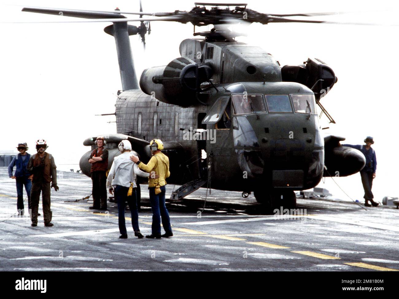 A CH-53 Sea Stallion helicopter on the flight deck of the amphibious ...