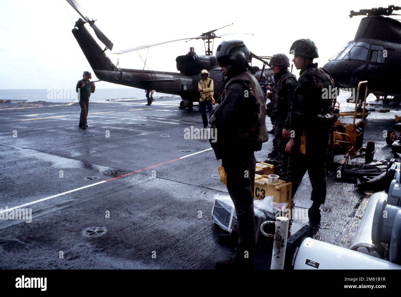 Flight operations take place abord the amphibious assault ship USS GUAM ...