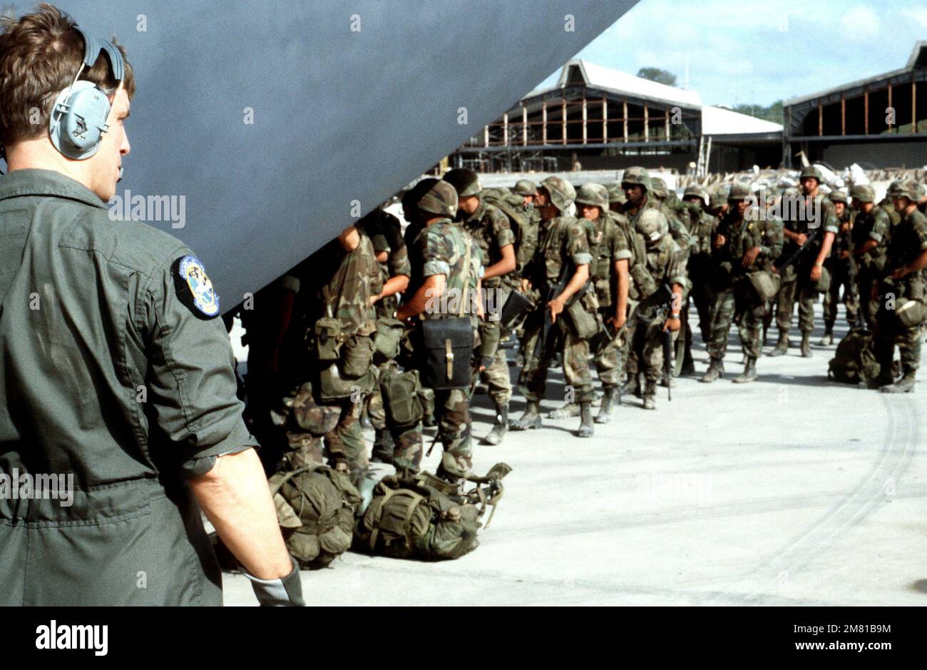 Members of the 82nd Airborne Division board a Military Airlift Command (MAC) C-141 Starlifter ...
