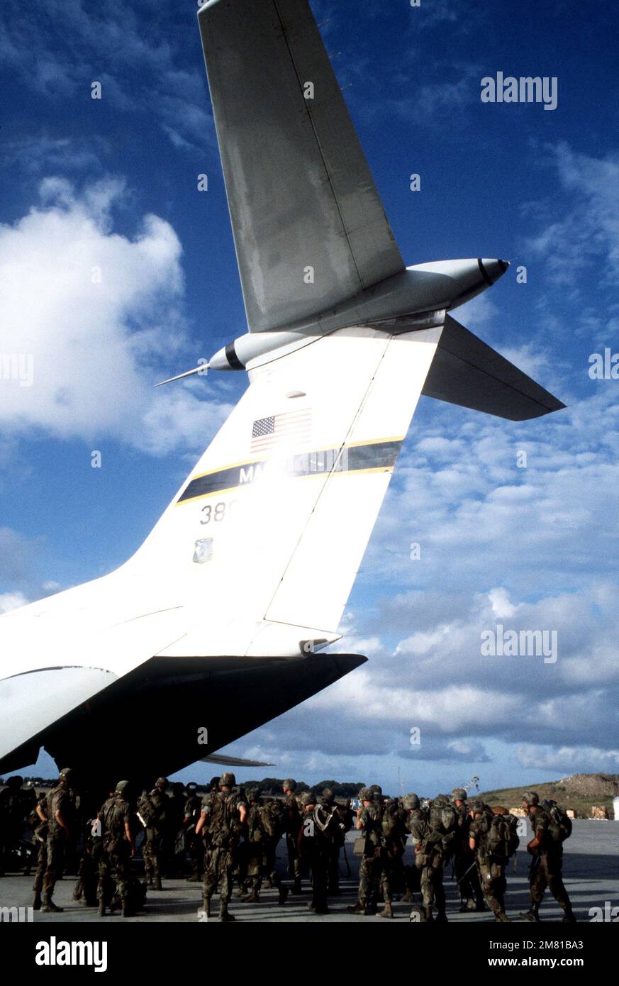 Members of the 82nd Airborne Division board a Military Airlift Command ...