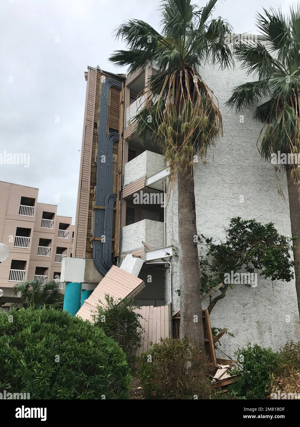 A vertical shot of a damaged building after Hurricane Harvey Stock ...