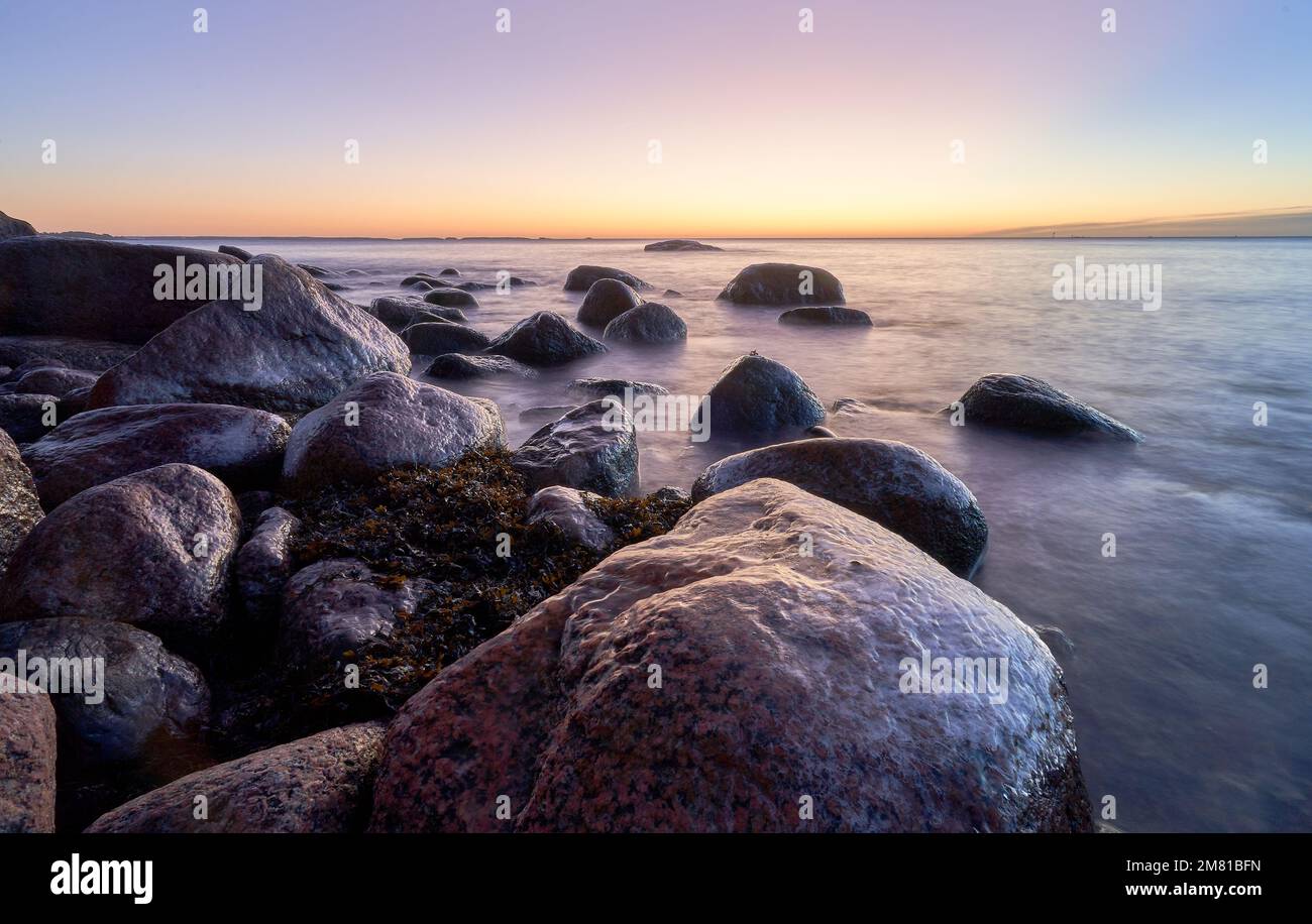 A beautiful shot of big rocks on a sea coastline Stock Photo - Alamy