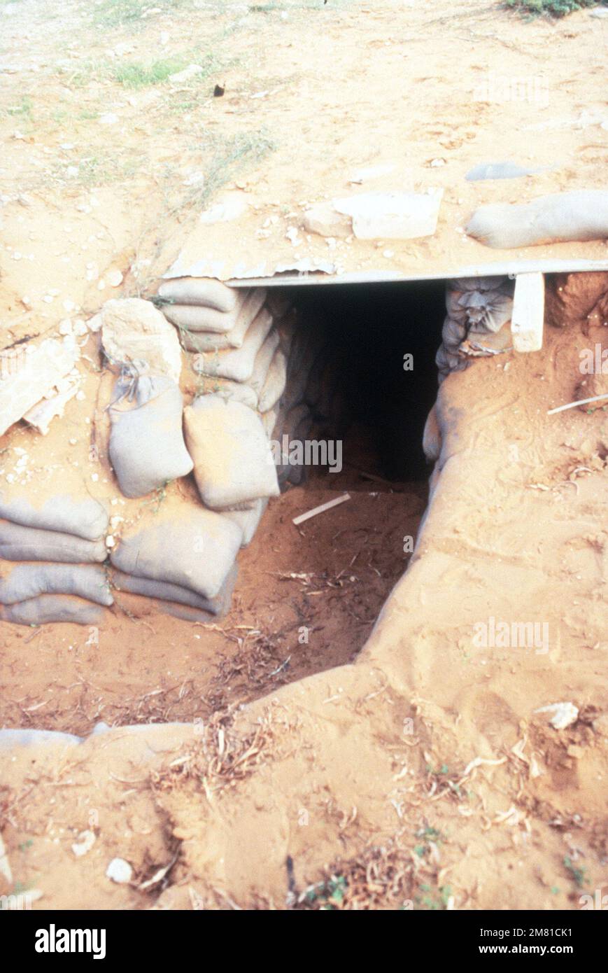 An earth-covered shelter at the command post bunker of Company G, 2nd ...