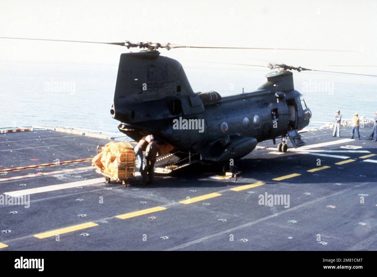 CH-46 Sea Knight helicopters parked on the forward flight deck of the ...