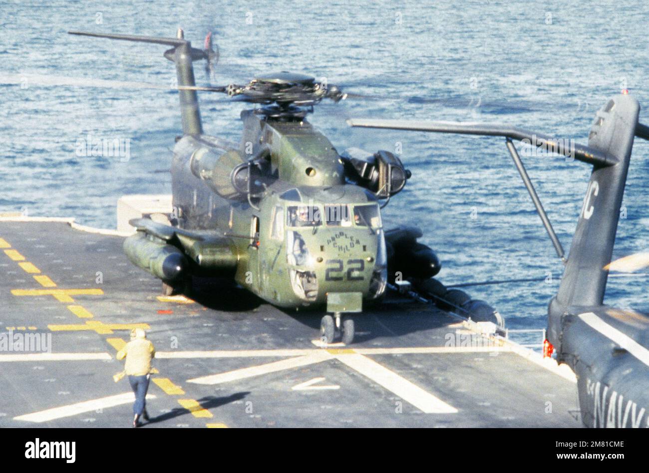A CH-53 Sea Stallion helicopter on the flight deck of the amphibious ...